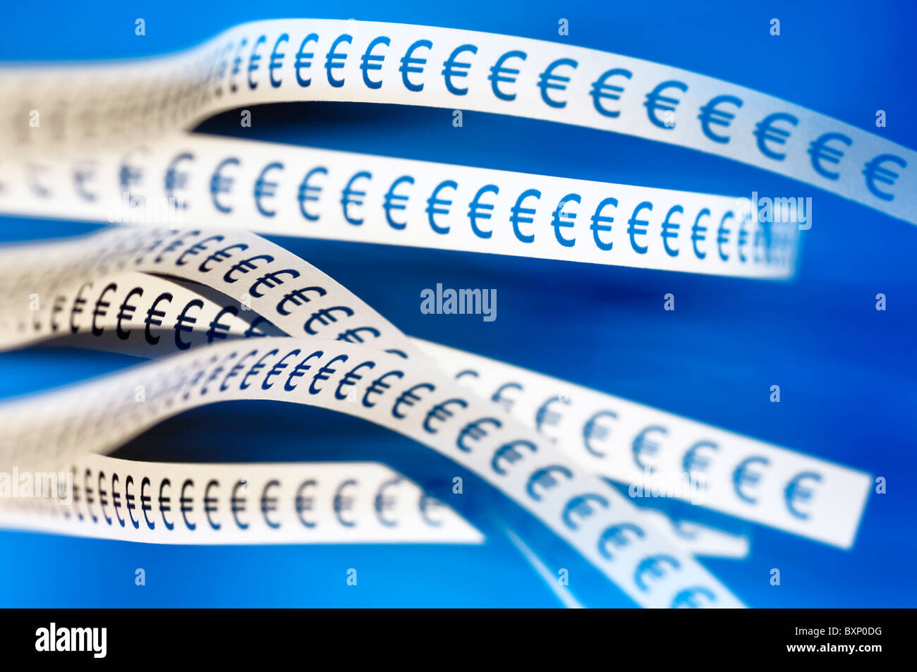 Paper ticker tape euro symbols Stock Photo - Alamy