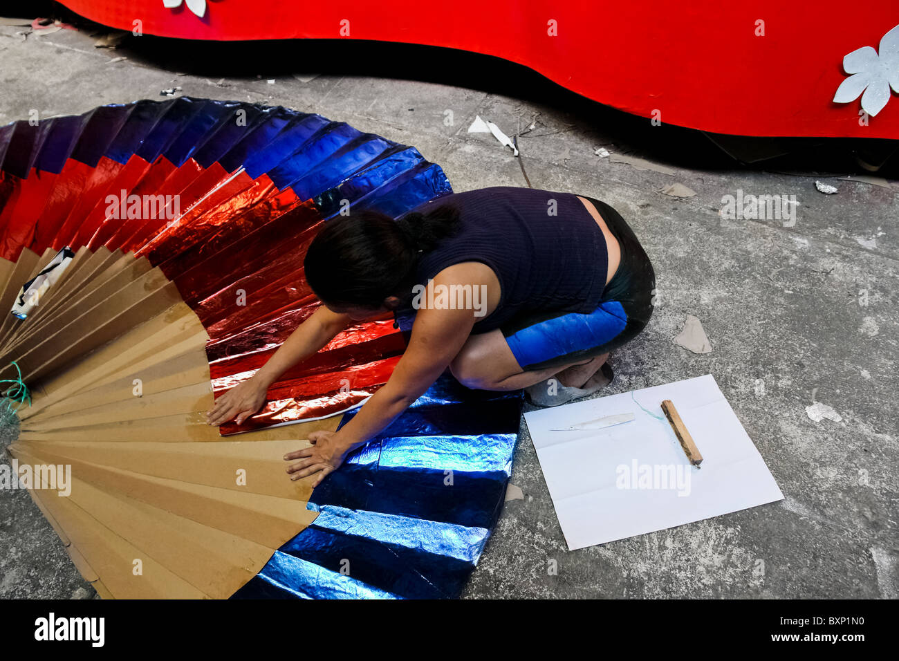 A Colombian woman works on the allegorical float in the Carnival ...