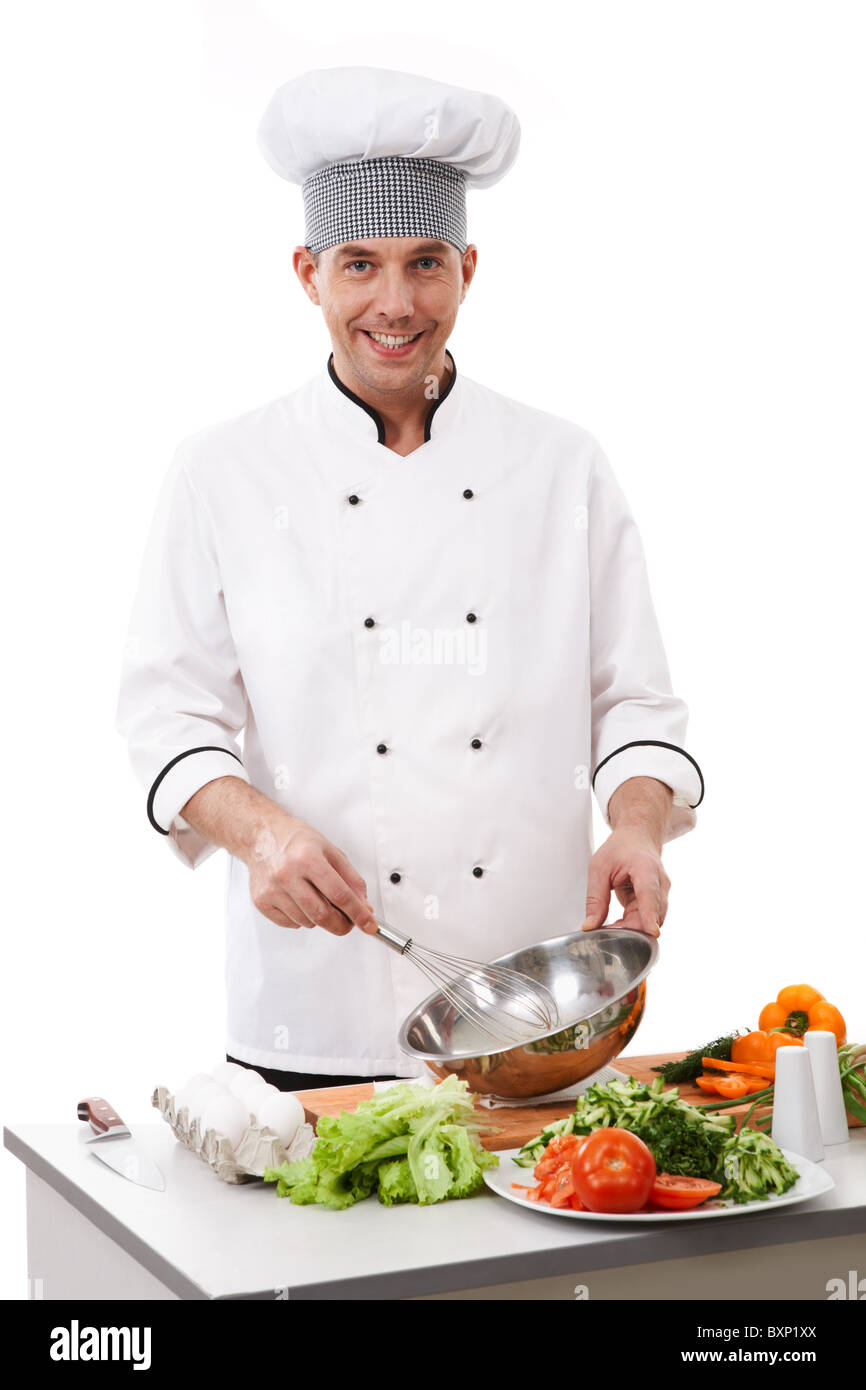 Portrait of handsome man in cook uniform smiling at camera during work ...