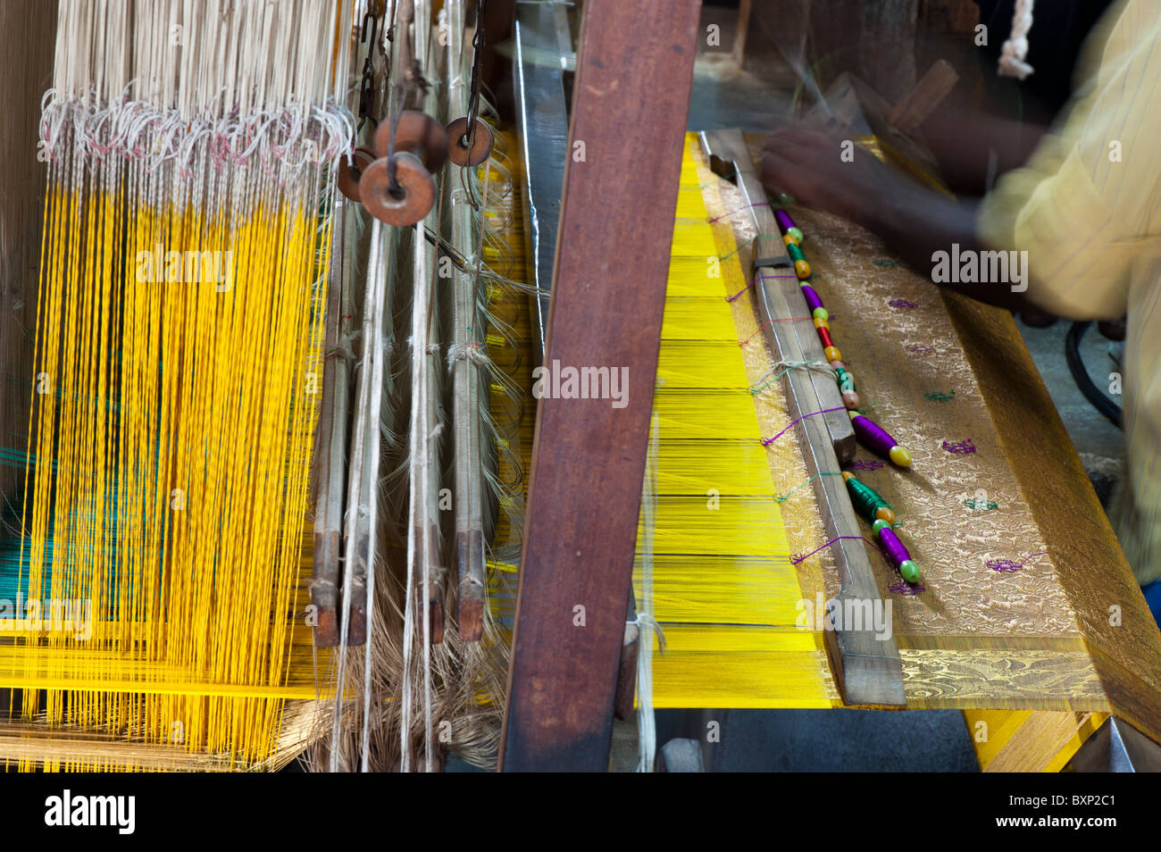 Hand loom making a silk sari in an Indian cottage. Andhra Pradesh ...