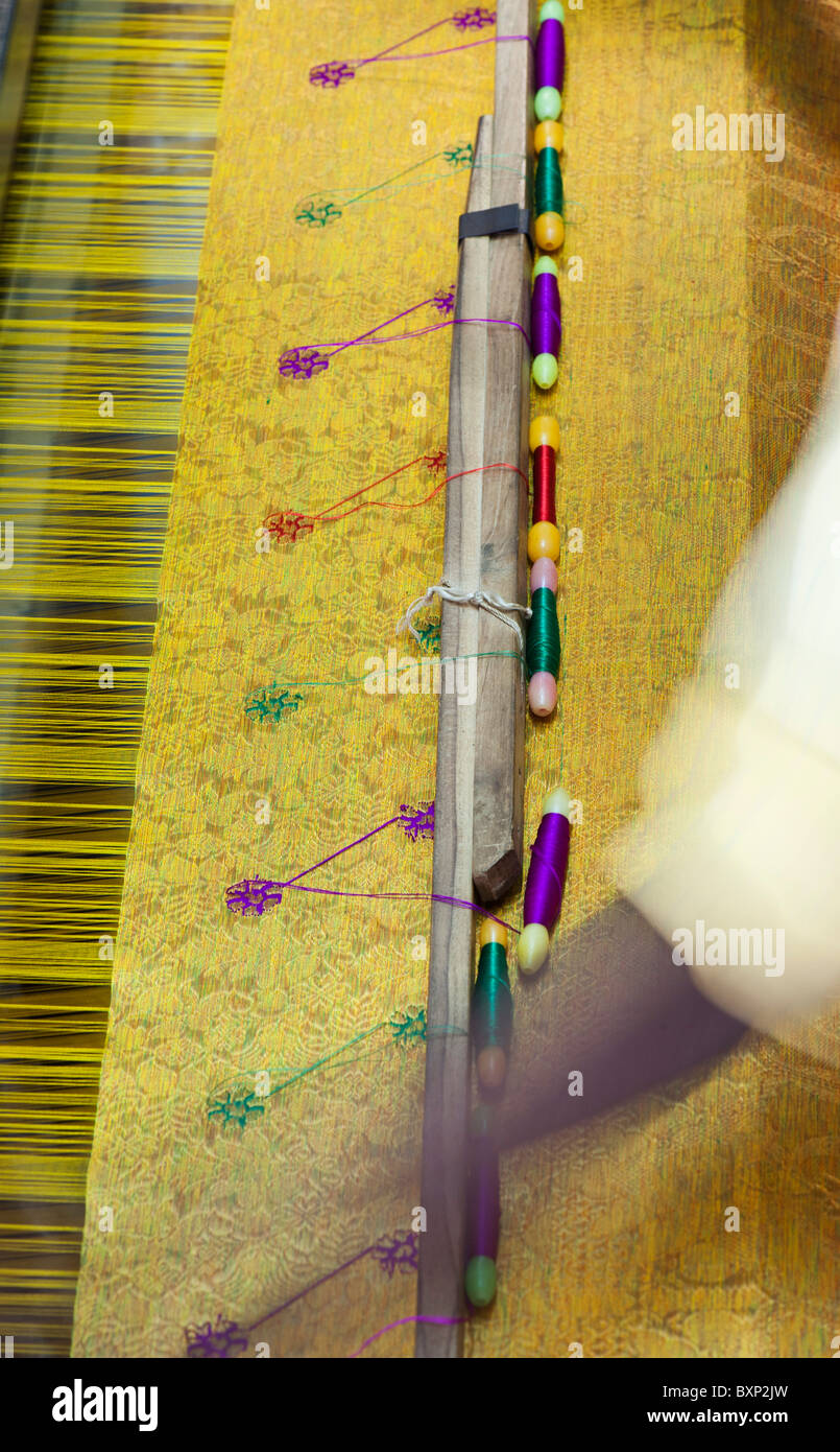 Hand loom making a silk sari in an Indian cottage. Andhra Pradesh ...