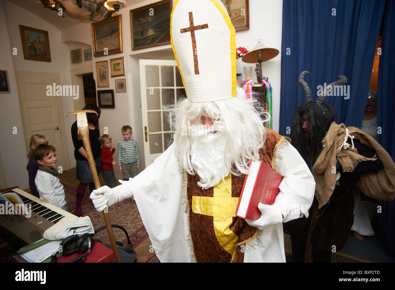 St. Nicholas Angel Devil visits children at home Stock Photo - Alamy