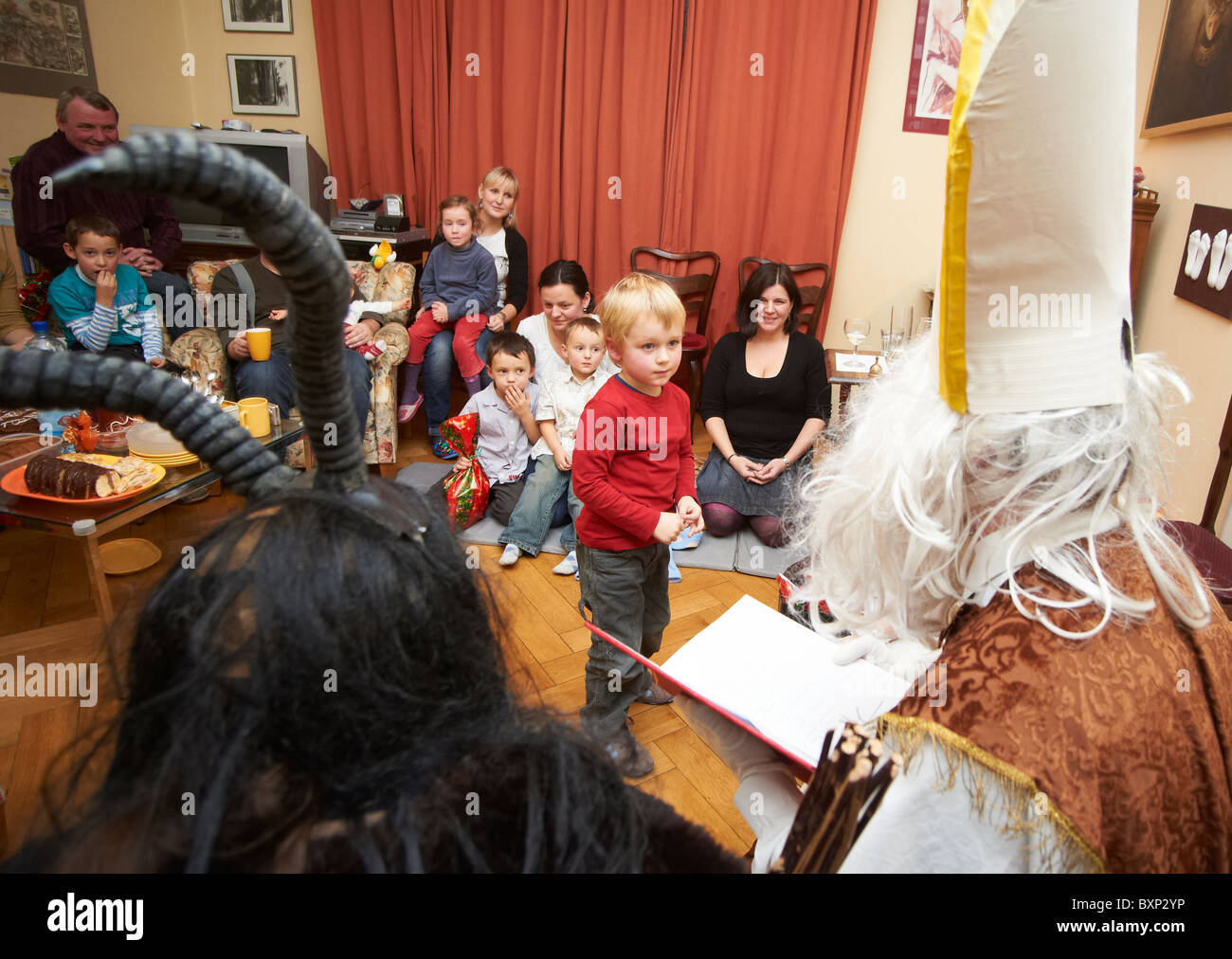 St. Nicholas Angel Devil visits children at home. Saint Nicholas, devil ...