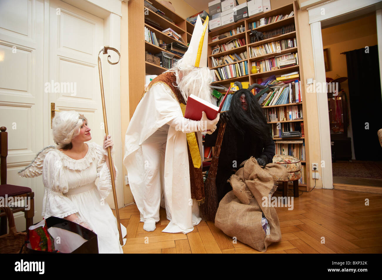 St. Nicholas Angel Devil visits children at home Stock Photo - Alamy
