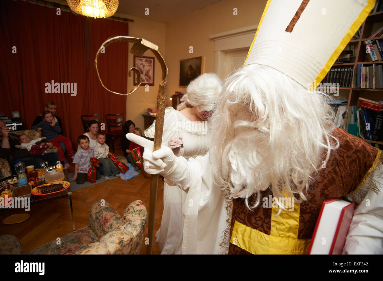 St. Nicholas Angel Devil visits children at home Stock Photo - Alamy