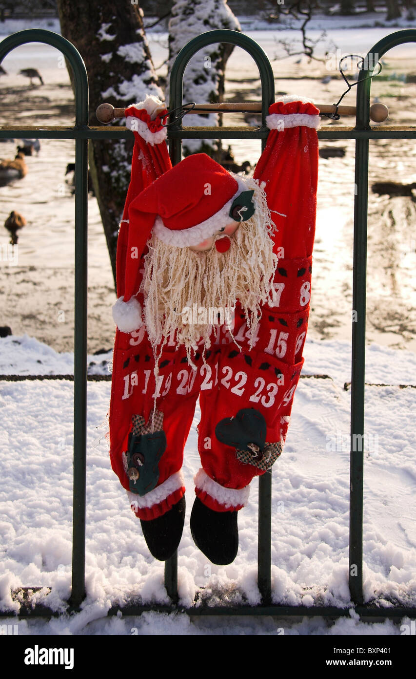 Advent calendar Santa Claus tied to a fence, Alexandra Park, Moss Side ...