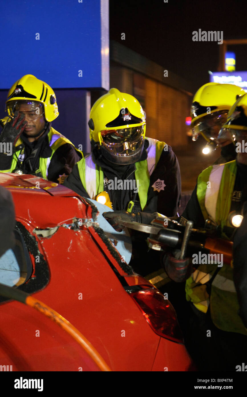 Firefighter using Holmatro rescue tool Stock Photo - Alamy