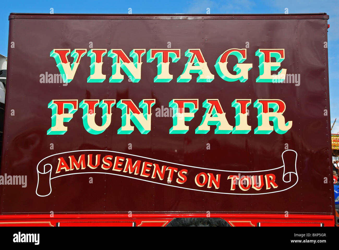 a vintage fun fair sign on the side of a truck Stock Photo - Alamy