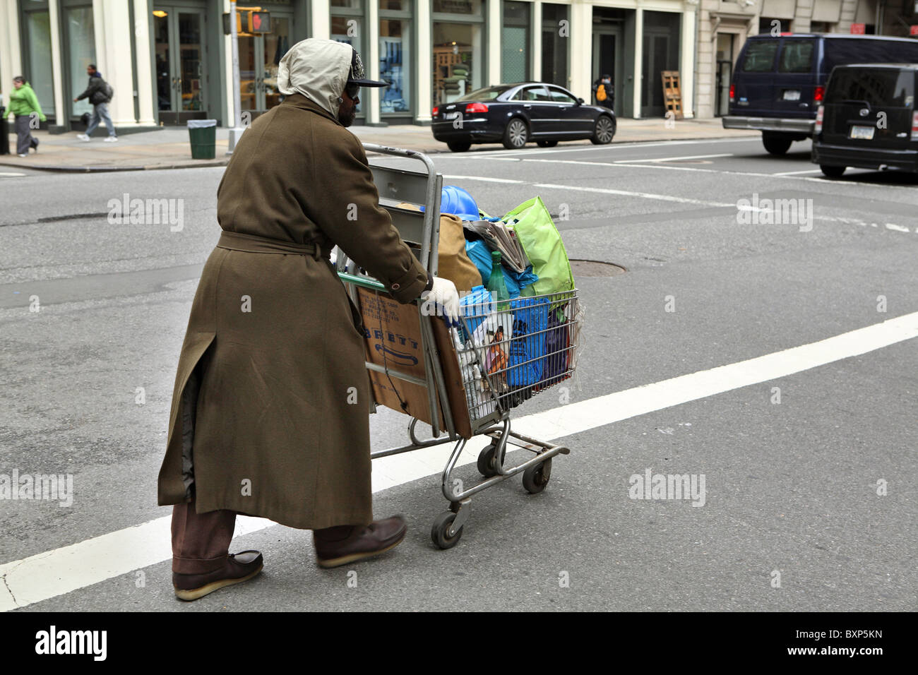 Homeless man pushing shopping cart hi-res stock photography and images ...