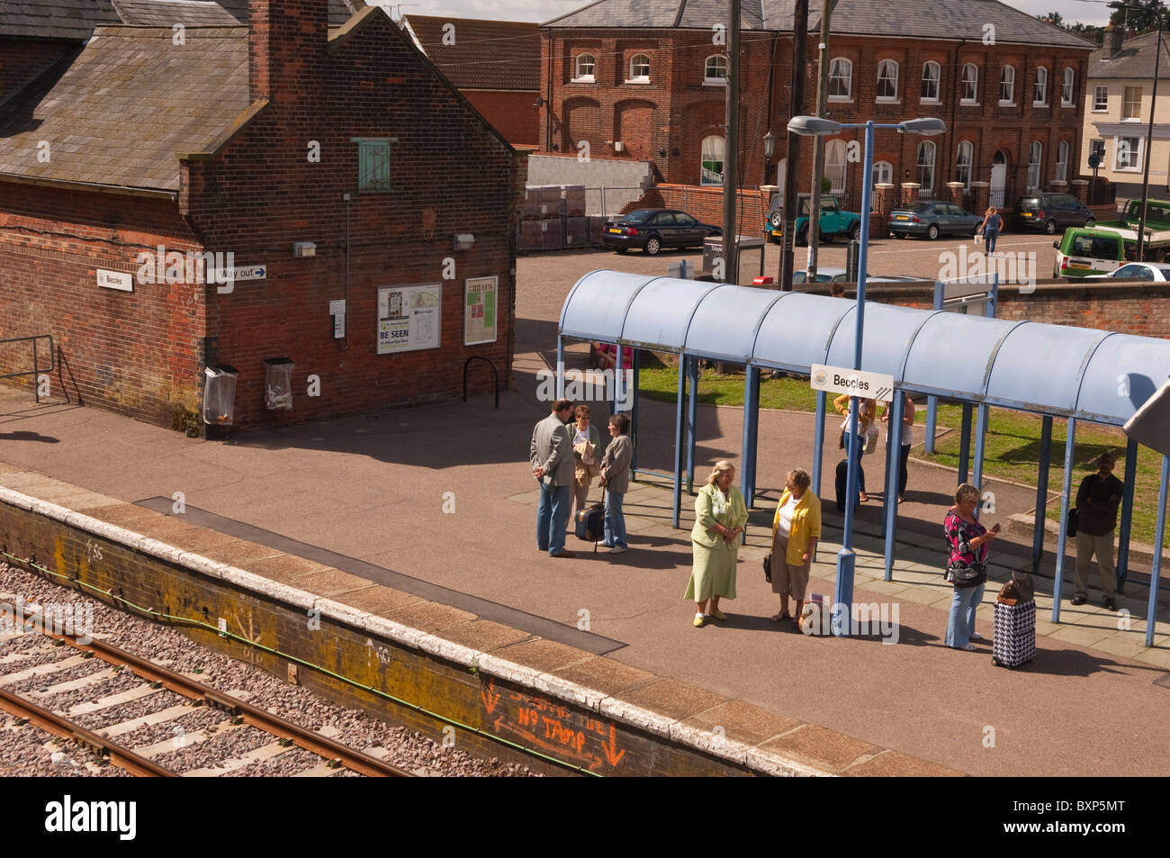 People waiting to catch a train at the station in Beccles , Suffolk ...