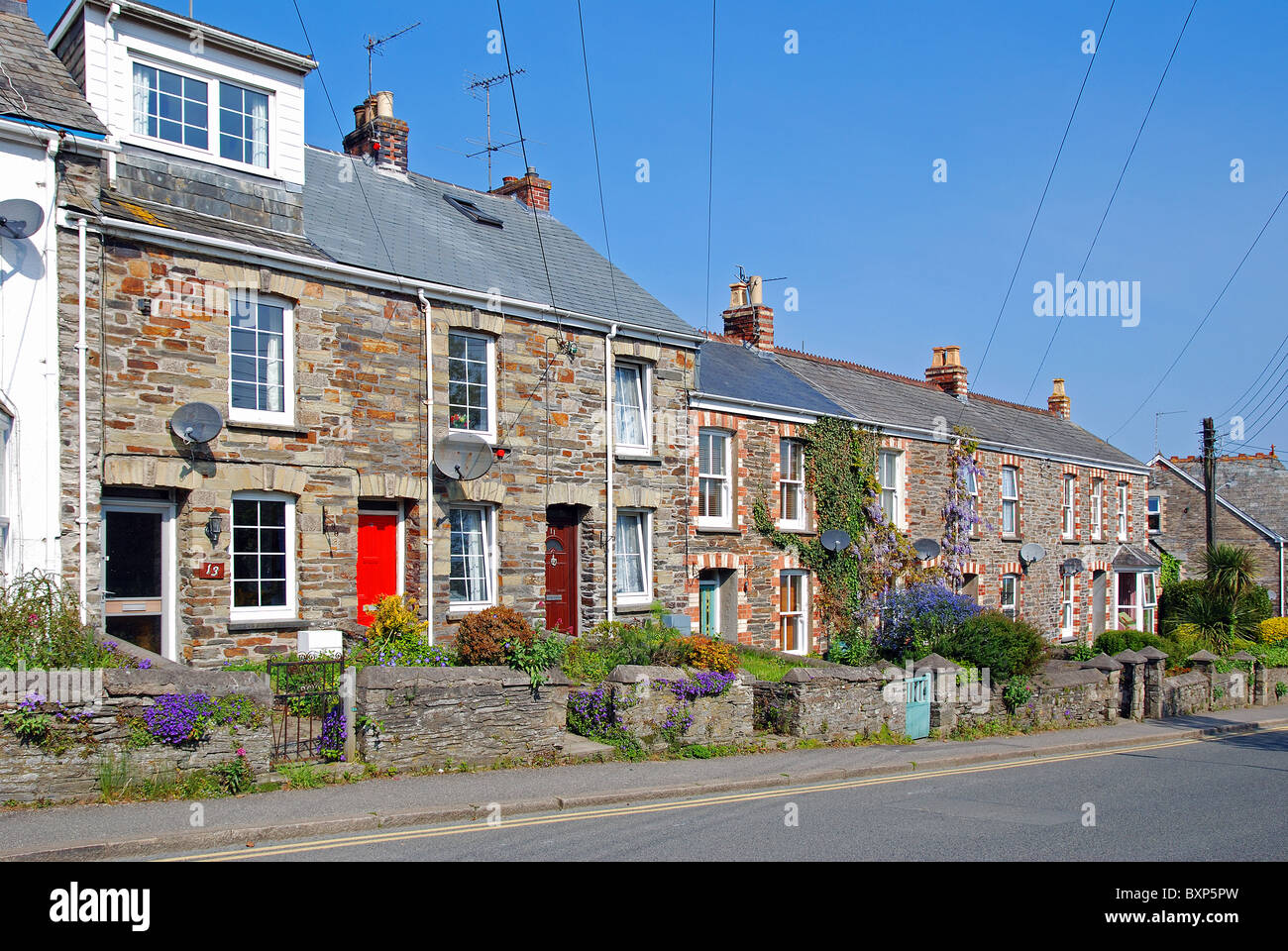 row of Victorian terraced stone cottages at Wadebridge in Cornwall, UK ...