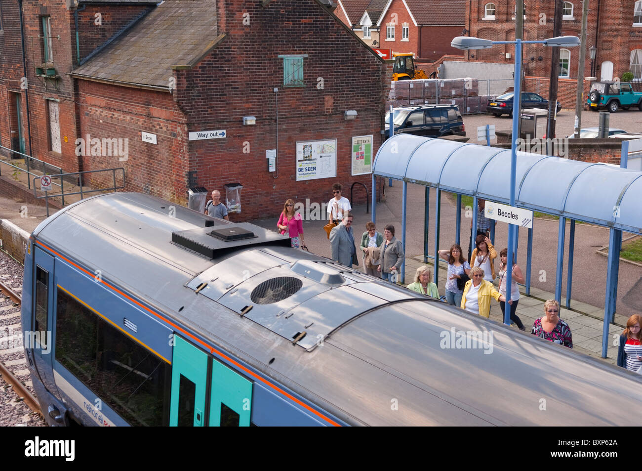People waiting to catch a train at the station in Beccles , Suffolk ...