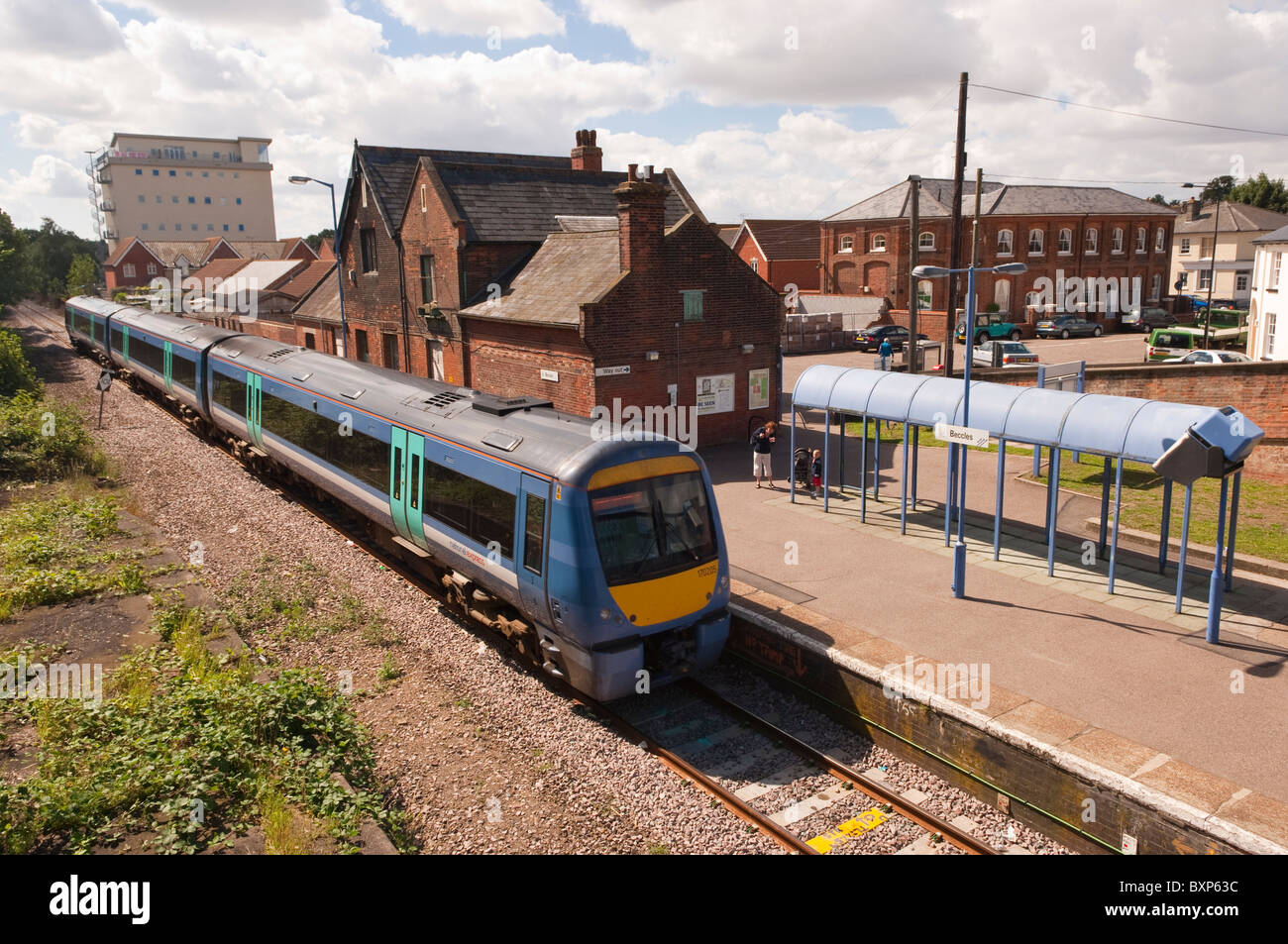 A class 170 diesel train leaves the station in Beccles , Suffolk ...