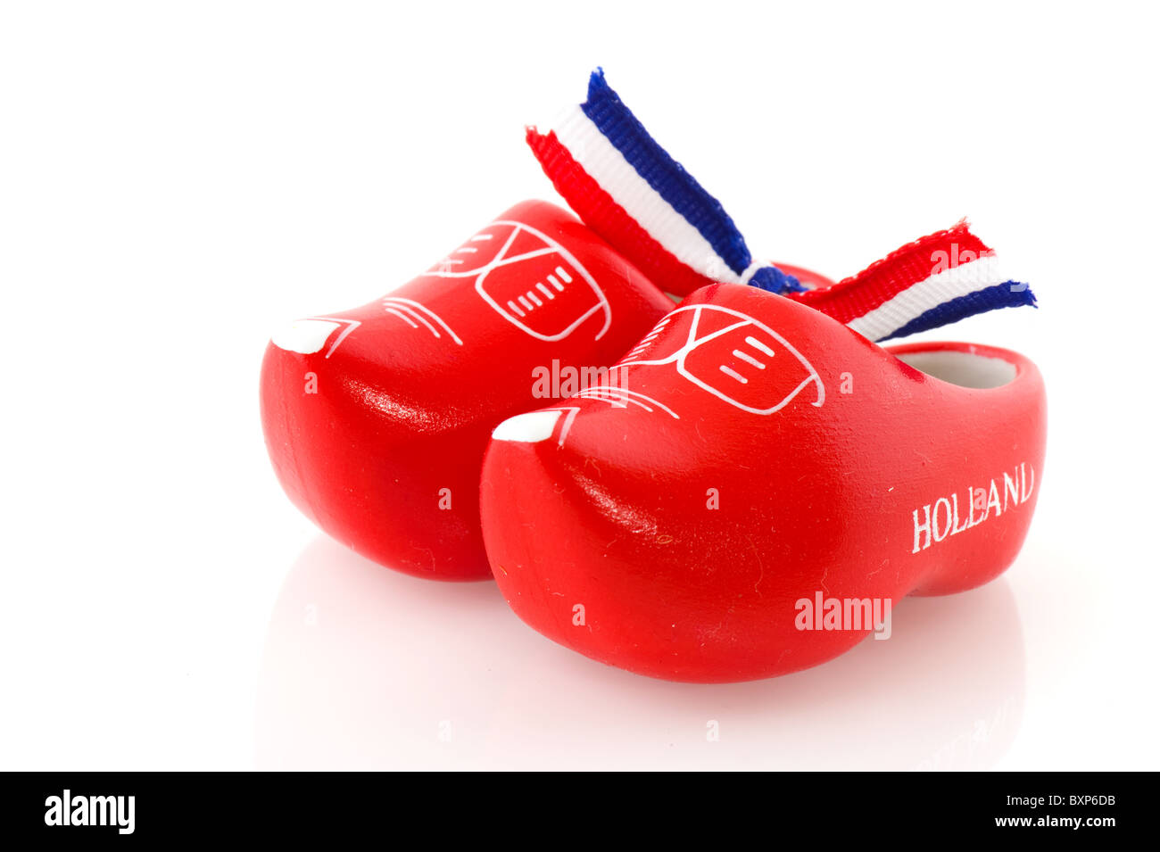 Red Dutch wooden clogs isolated over white Stock Photo - Alamy