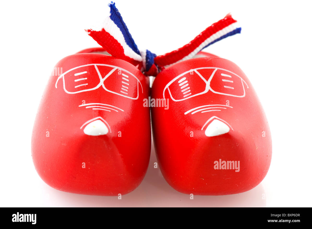Red Dutch wooden clogs isolated over white Stock Photo - Alamy