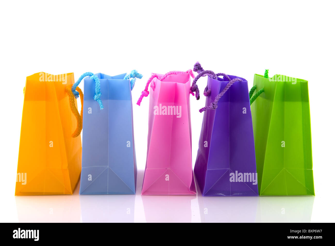 Colorful empty shopping bags isolated over white Stock Photo - Alamy