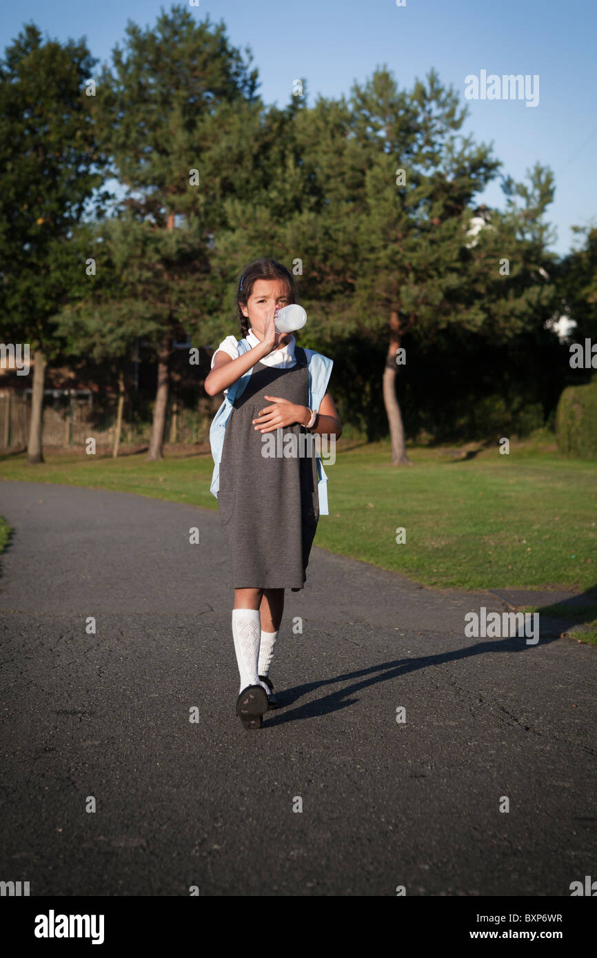 Schoolgirl drinking water from water hi-res stock photography and ...