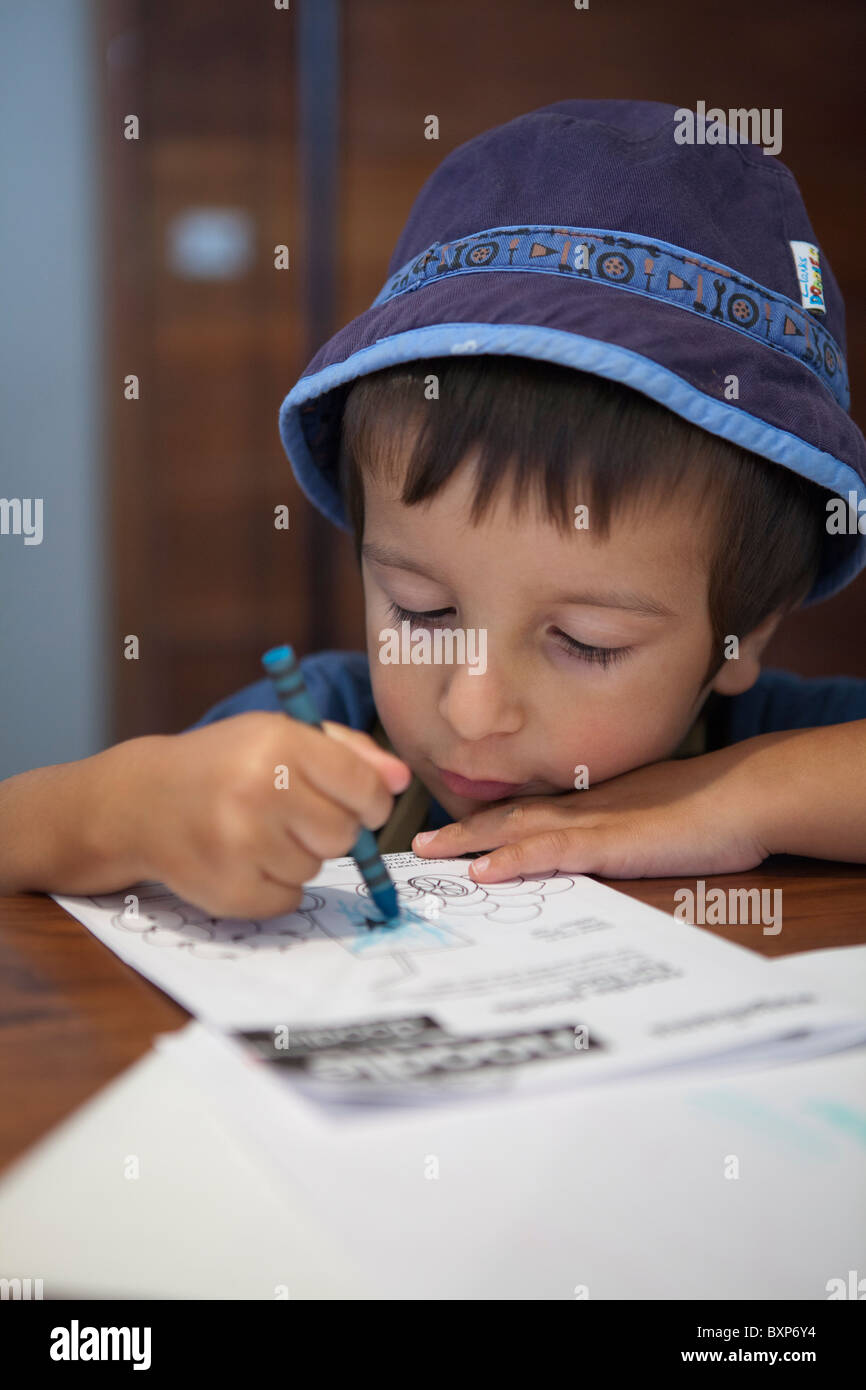child colouring with crayons Stock Photo - Alamy