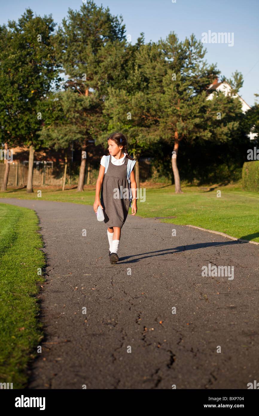 girl walking home from school Stock Photo - Alamy