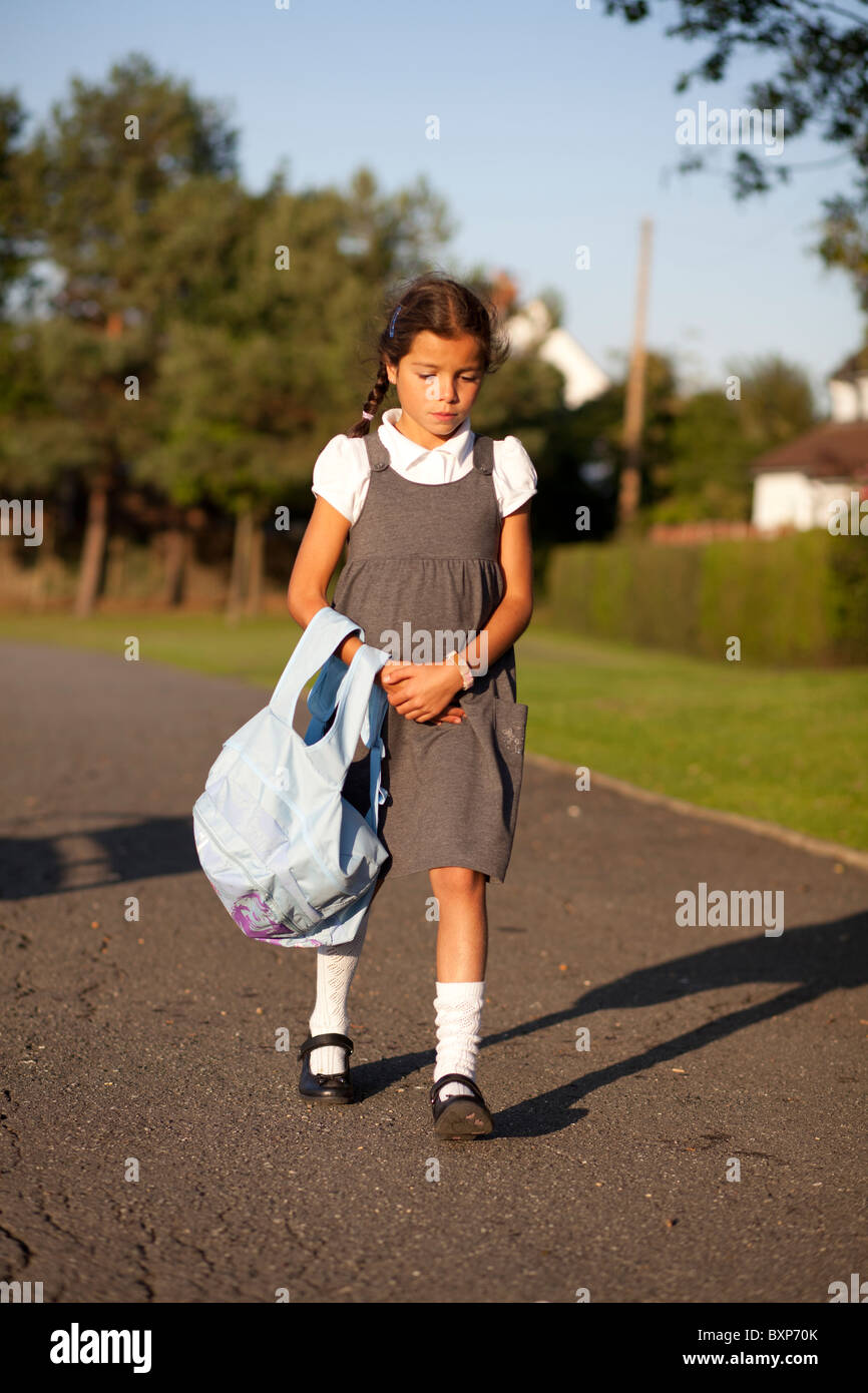 girl walking home from school Stock Photo - Alamy