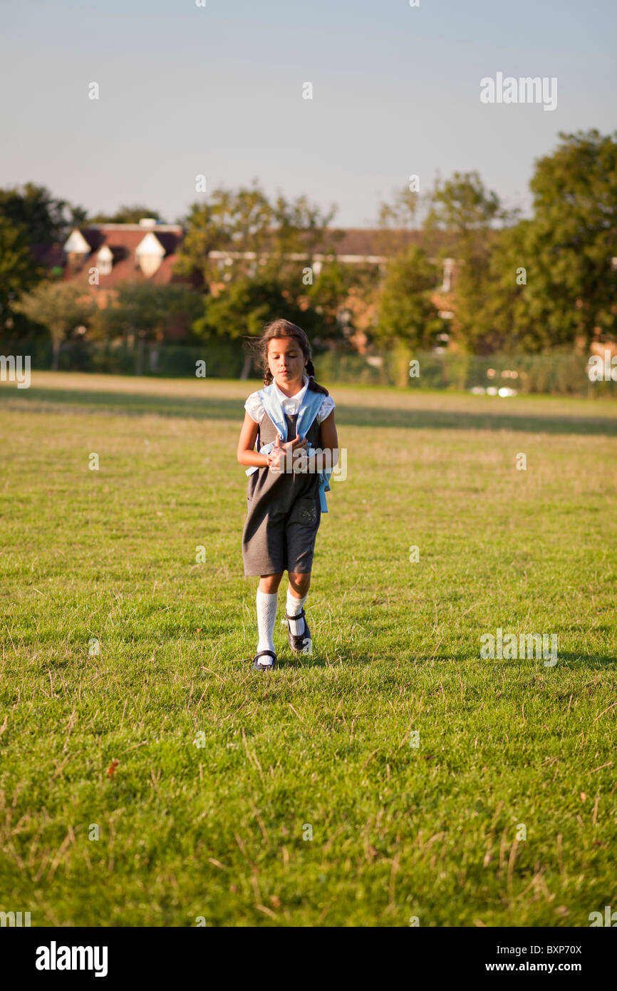 girl walking home from school Stock Photo - Alamy