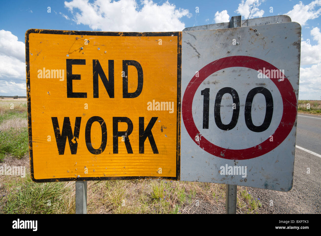 Signs indicating end of road work and speed limit of 100 kph Stock ...