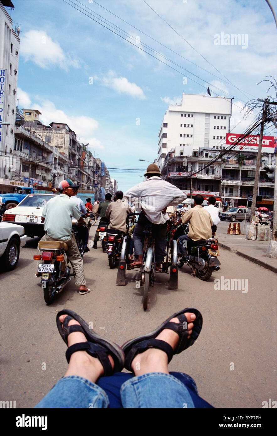 Tourist's Feet On A Rickshaw In A Busy Street Scene Stock Photo - Alamy