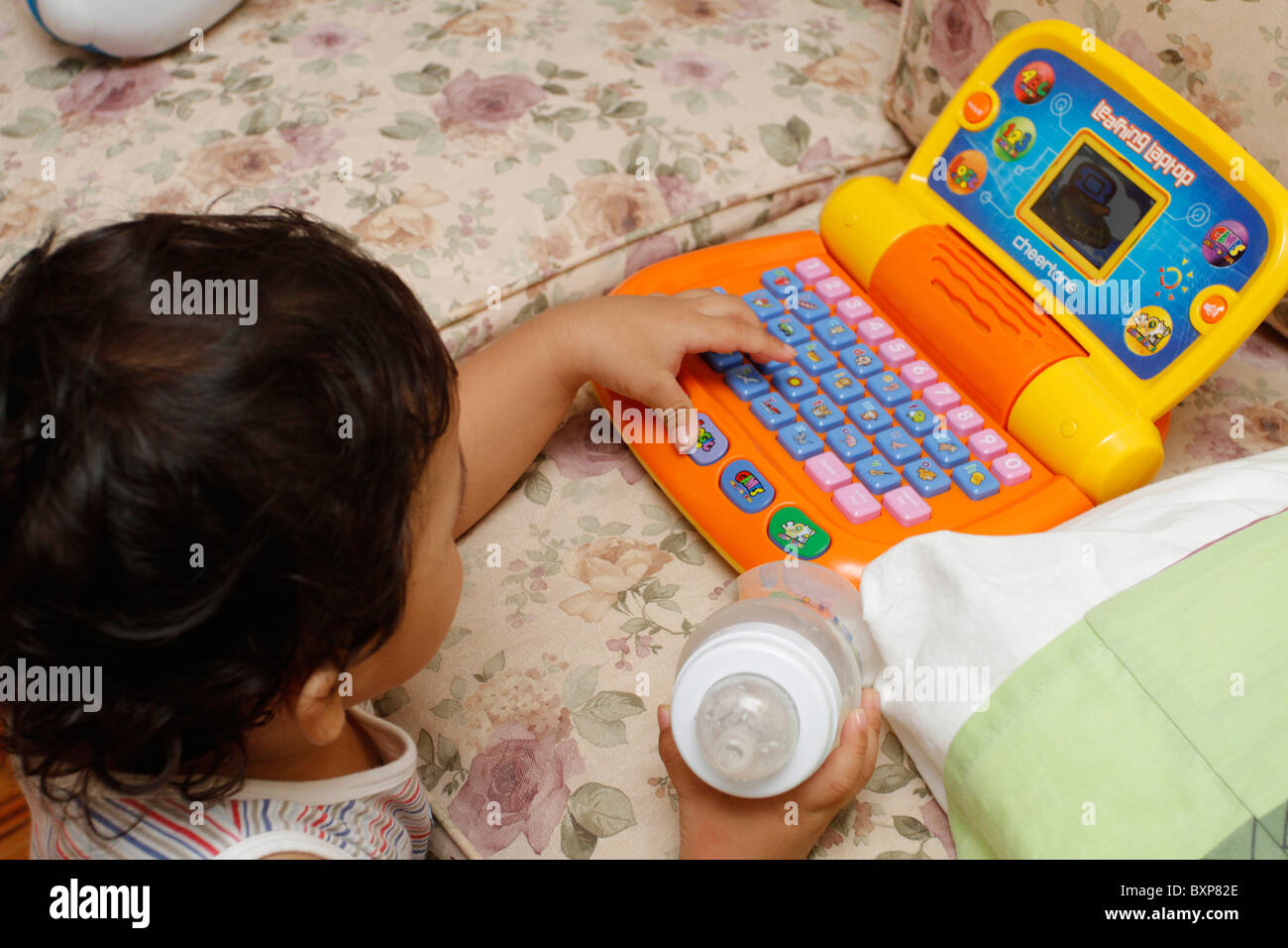 Child using toy laptop Stock Photo - Alamy