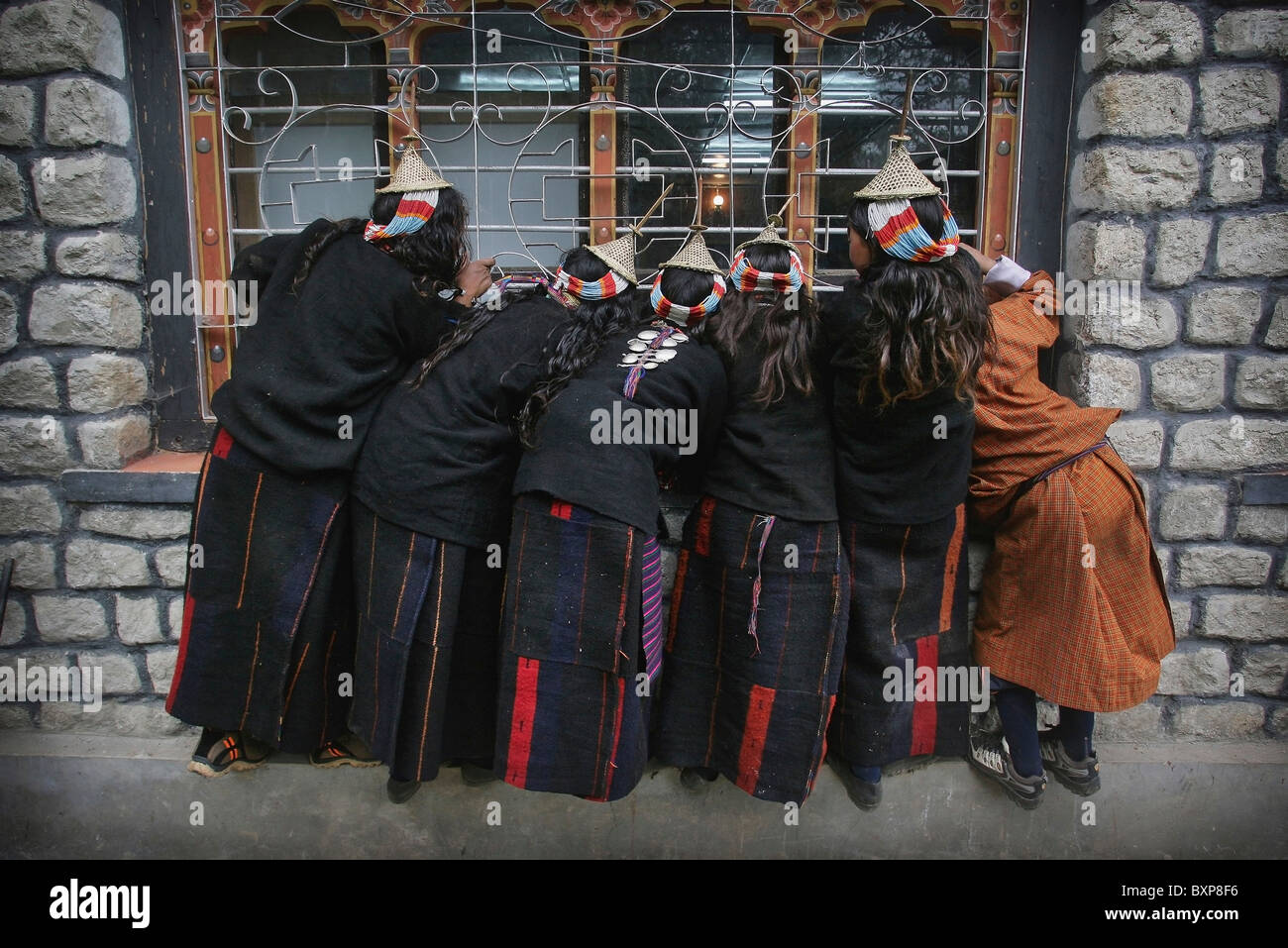 Layap Girls Peaking Into Window Stock Photo - Alamy