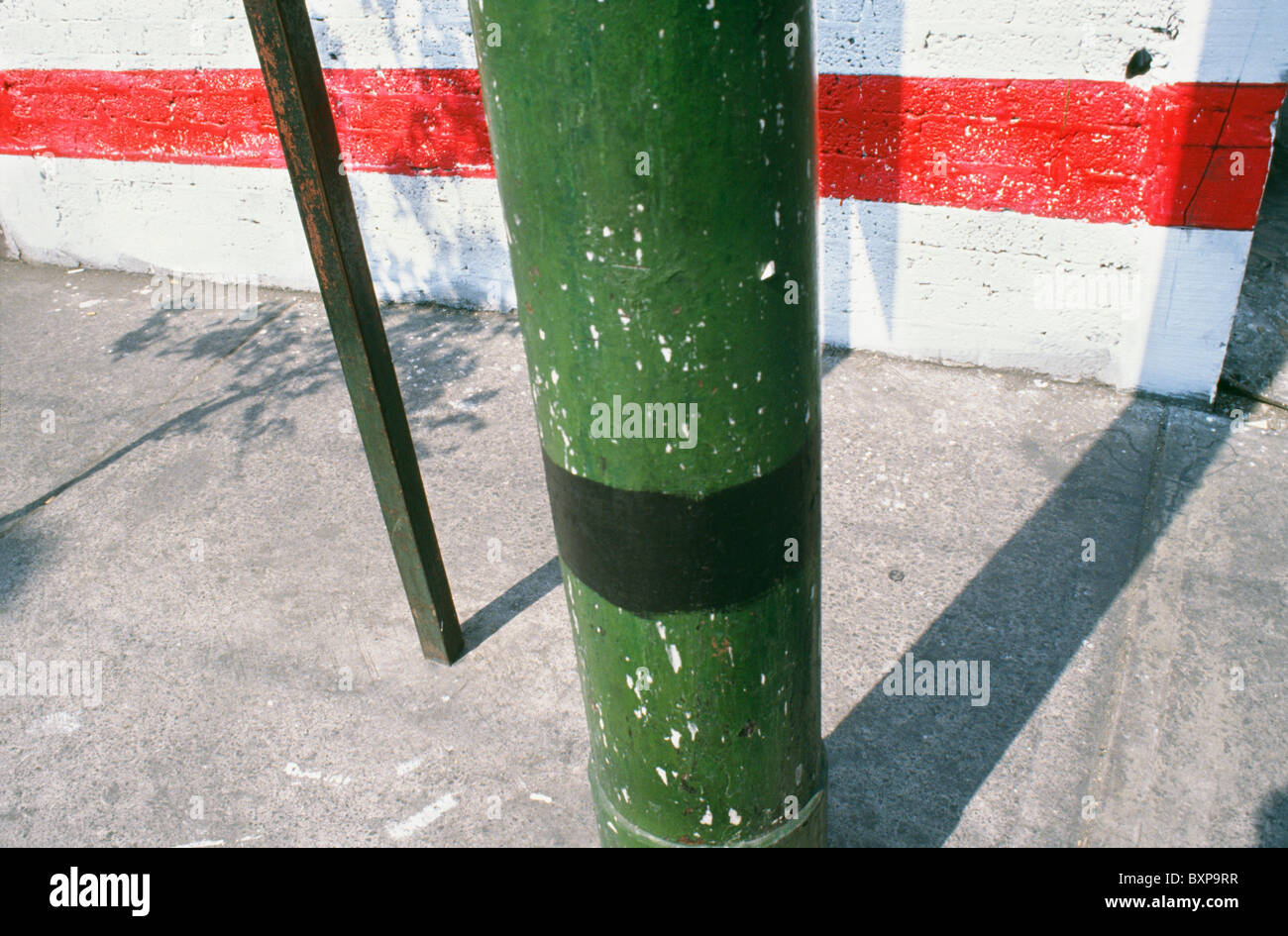 Post With Shadow Projected On Wall Behind Stock Photo - Alamy