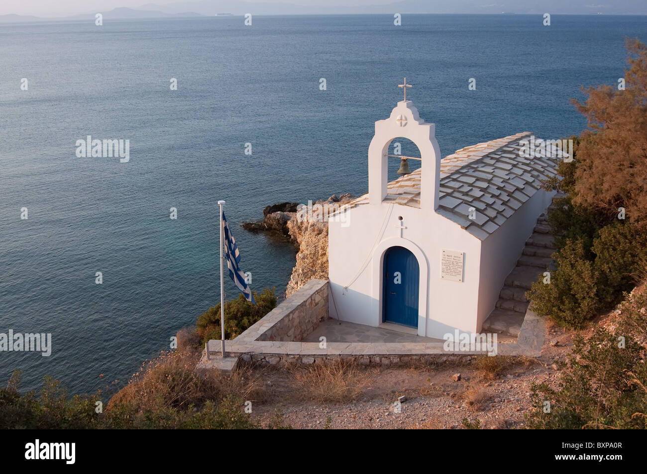 A typical Greek white little church standing by the sea in Kythera ...