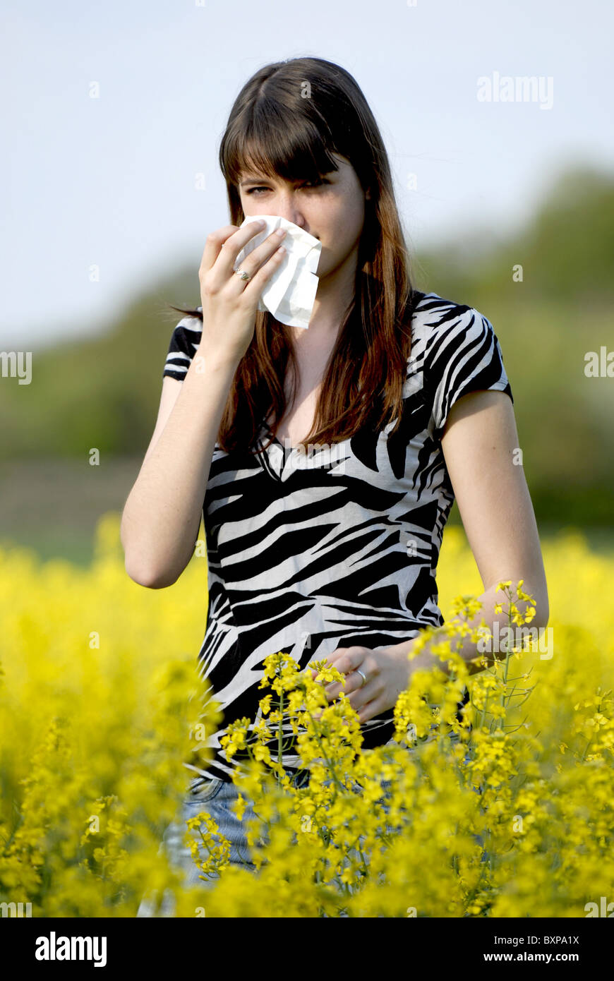 Young woman suffering from hay fever Stock Photo - Alamy