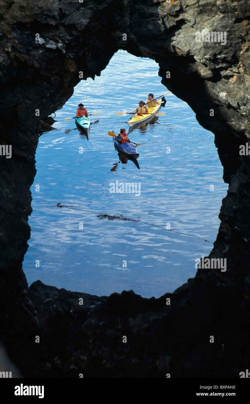 People Sea Kayaking At Hole In The Wall Stock Photo - Alamy