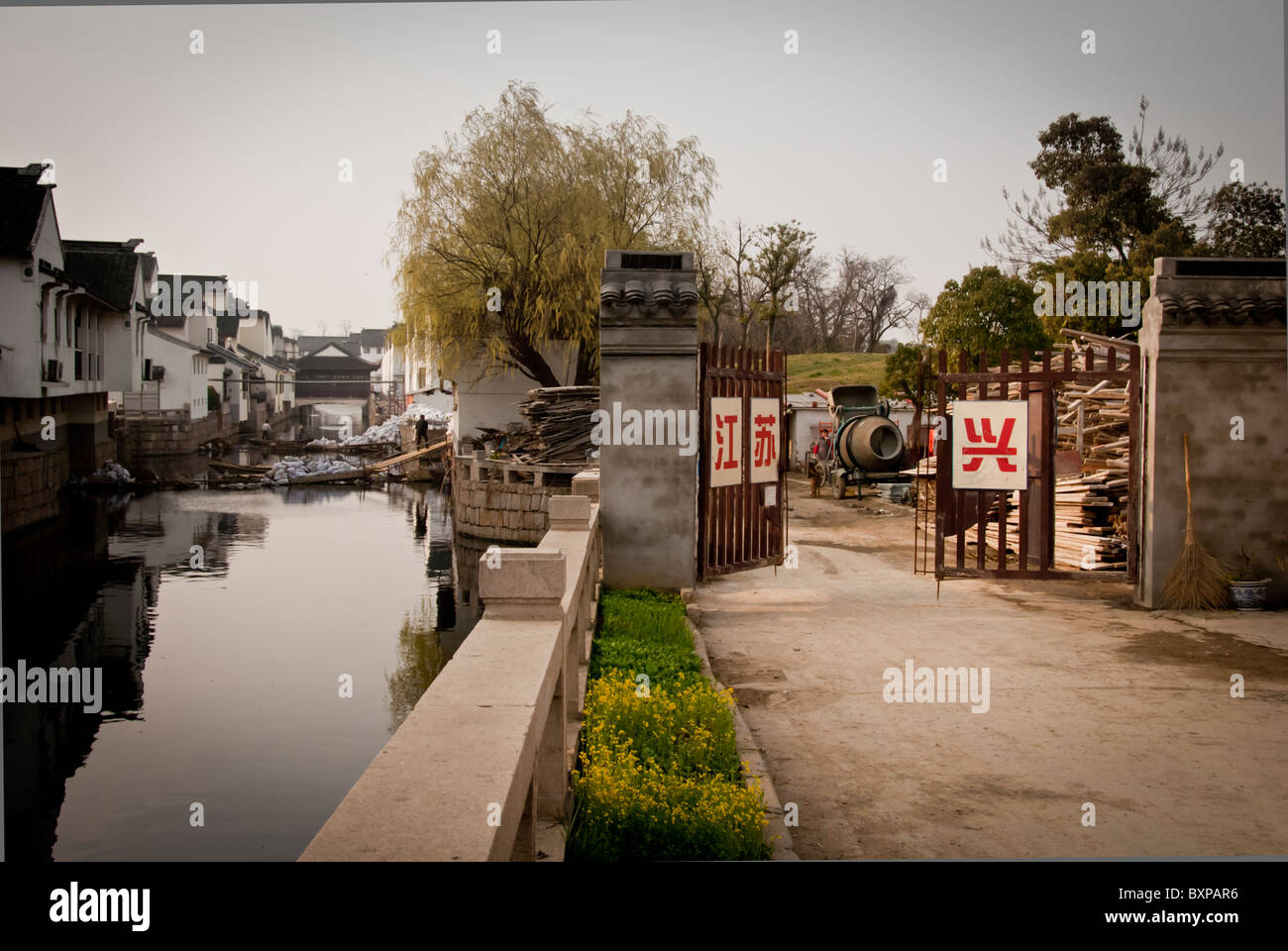 A canal and builder's yard in Suzhou, Jiangsu Province, China Stock ...