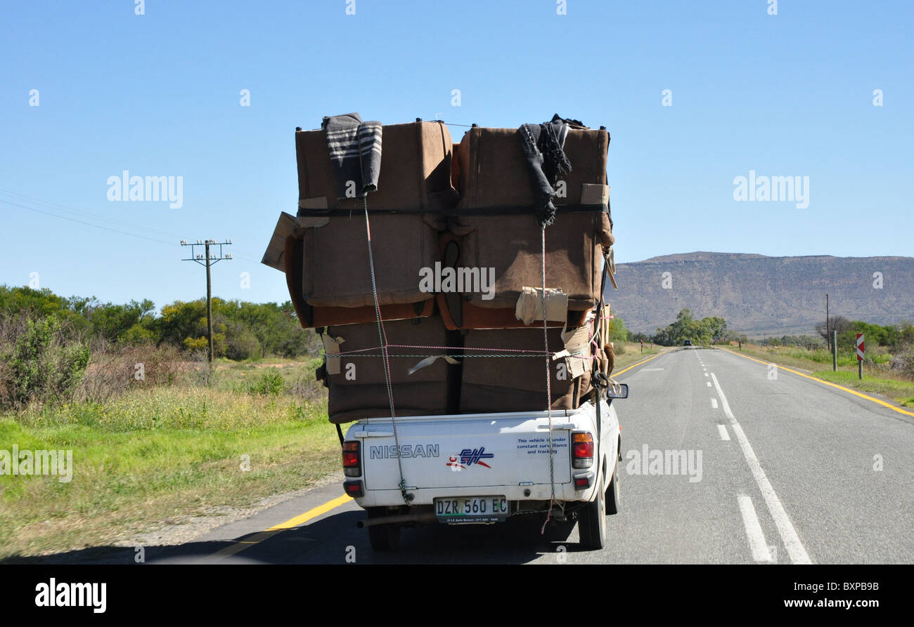 Big load on small cars on African roads Stock Photo - Alamy