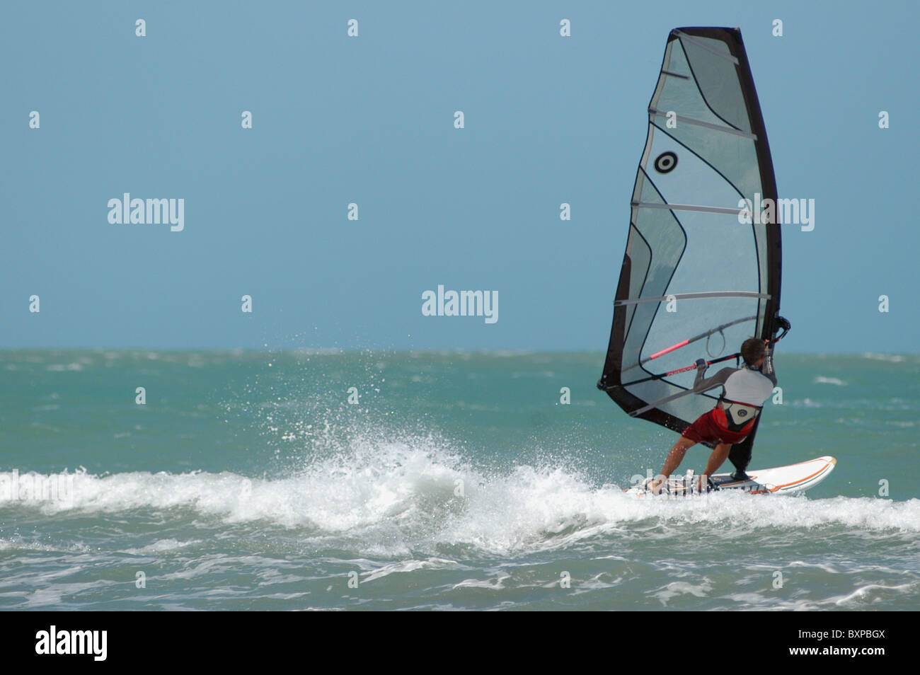 Man Windsurfing On Sea Stock Photo - Alamy