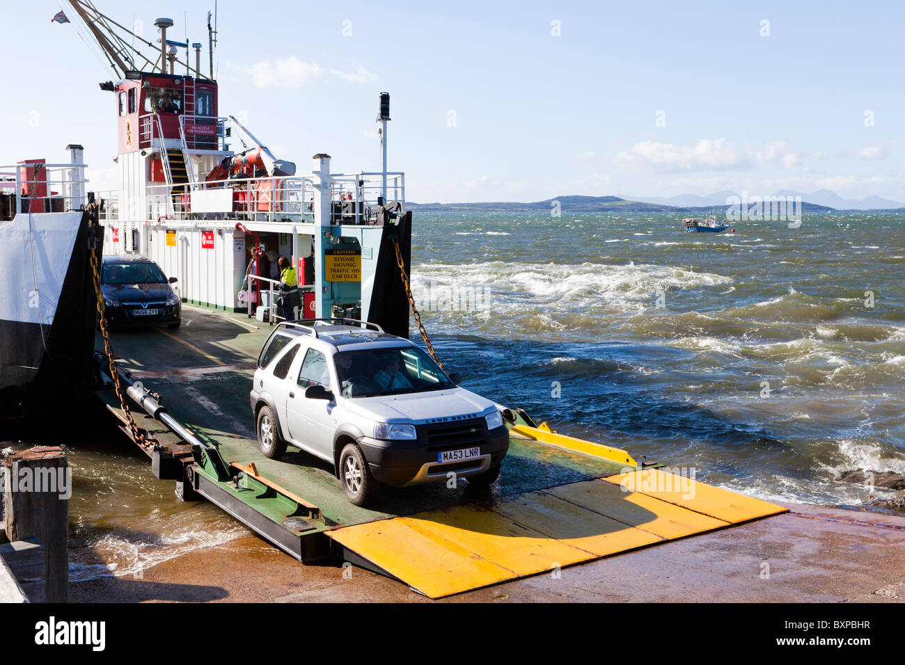 Disembarking from the Caledonian MacBrayne Gigha ferry arriving at ...