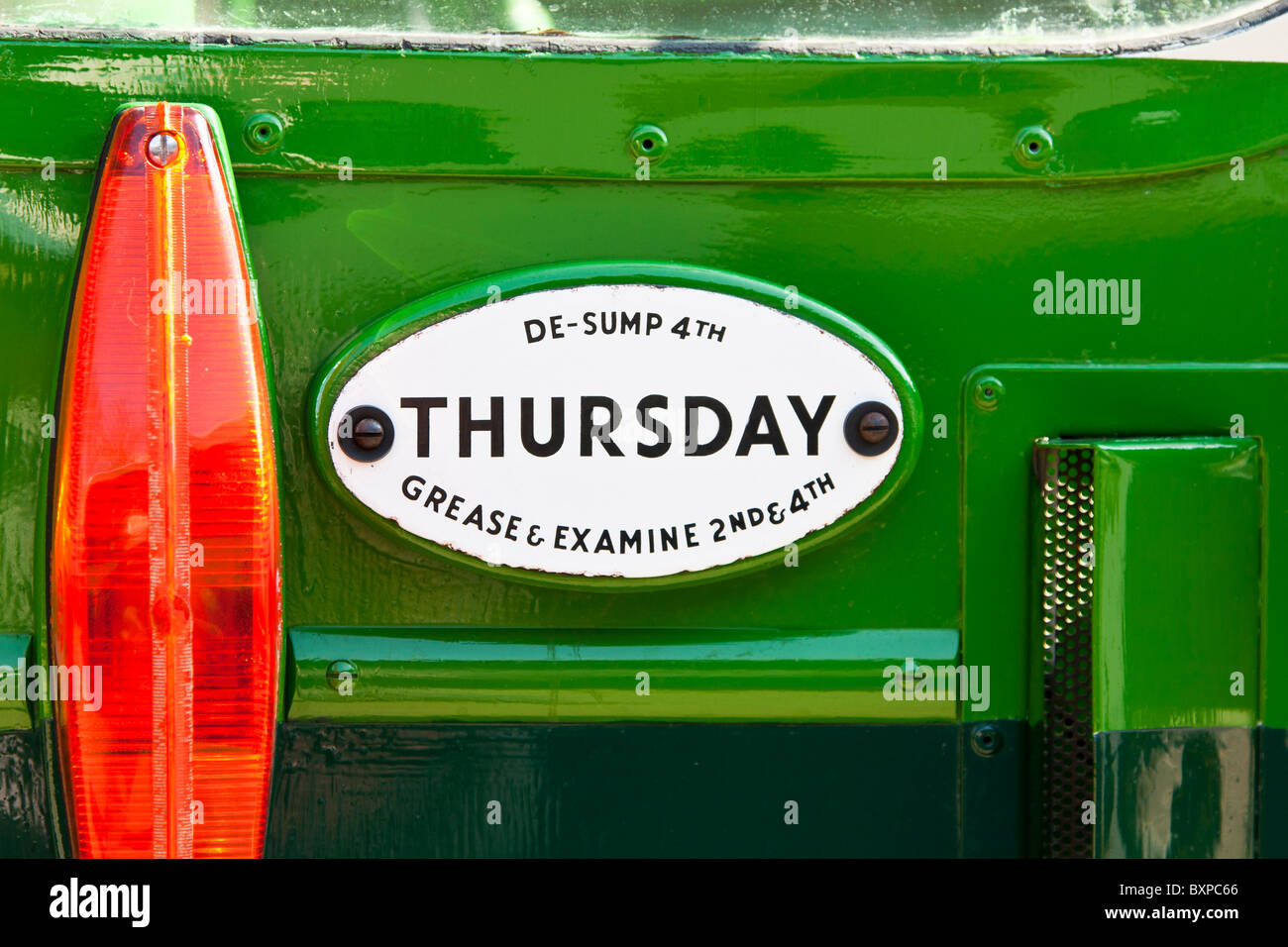 Indicator lens on bus with maintenance schedule Stock Photo - Alamy