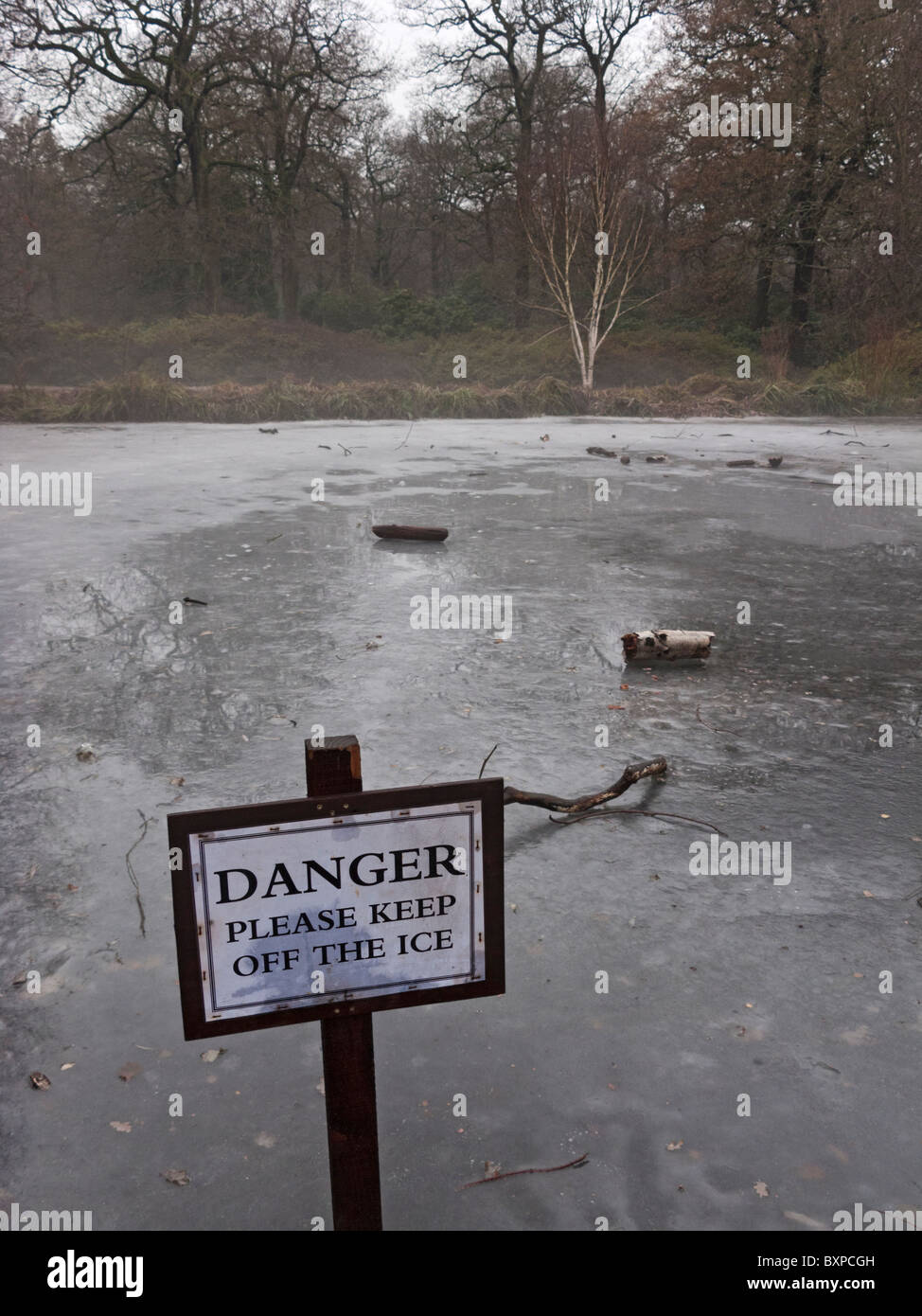Danger, thin ice sign keep off the ice Stock Photo - Alamy