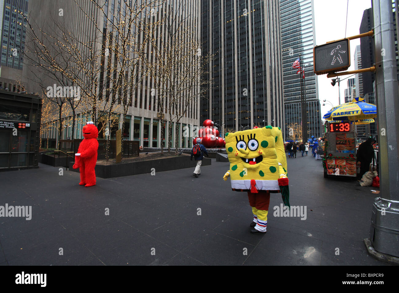 Spongebob and Elmo in Rockefeller center on Sixth Ave, New York city ...