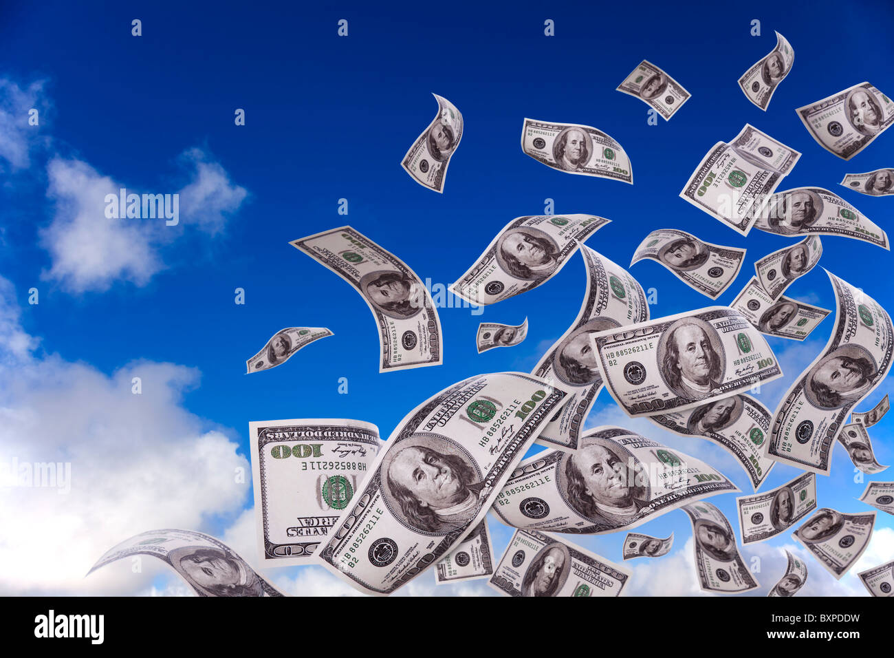 lots of dollar bills falling from the sky Stock Photo - Alamy