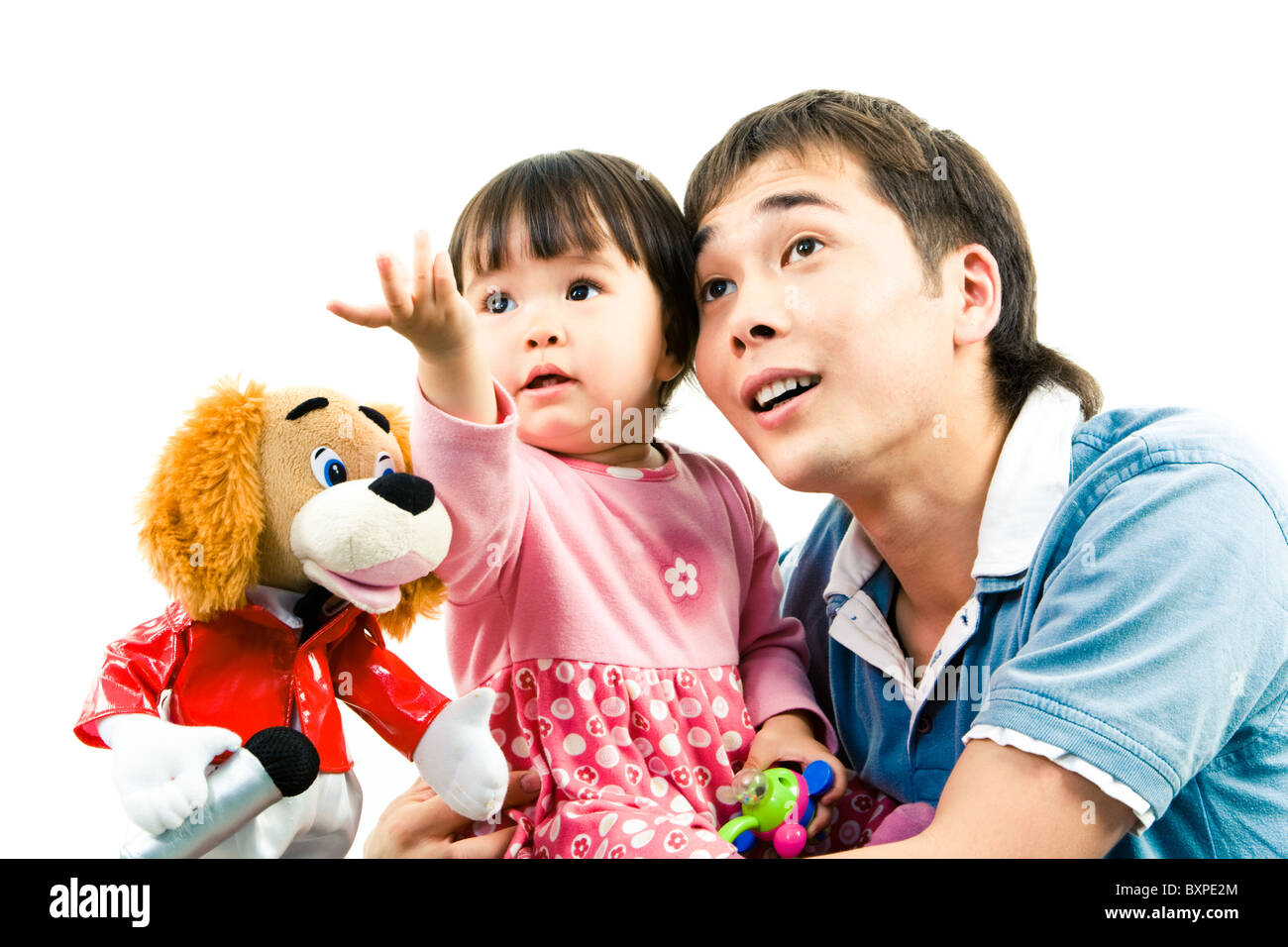 Photo of father and child watching at something with cute toy near by ...