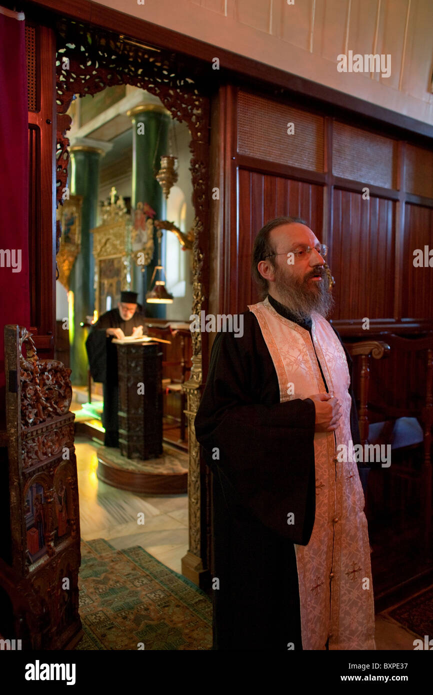 Priest during a mass at the altar in the Church of the Holy Trinity ...
