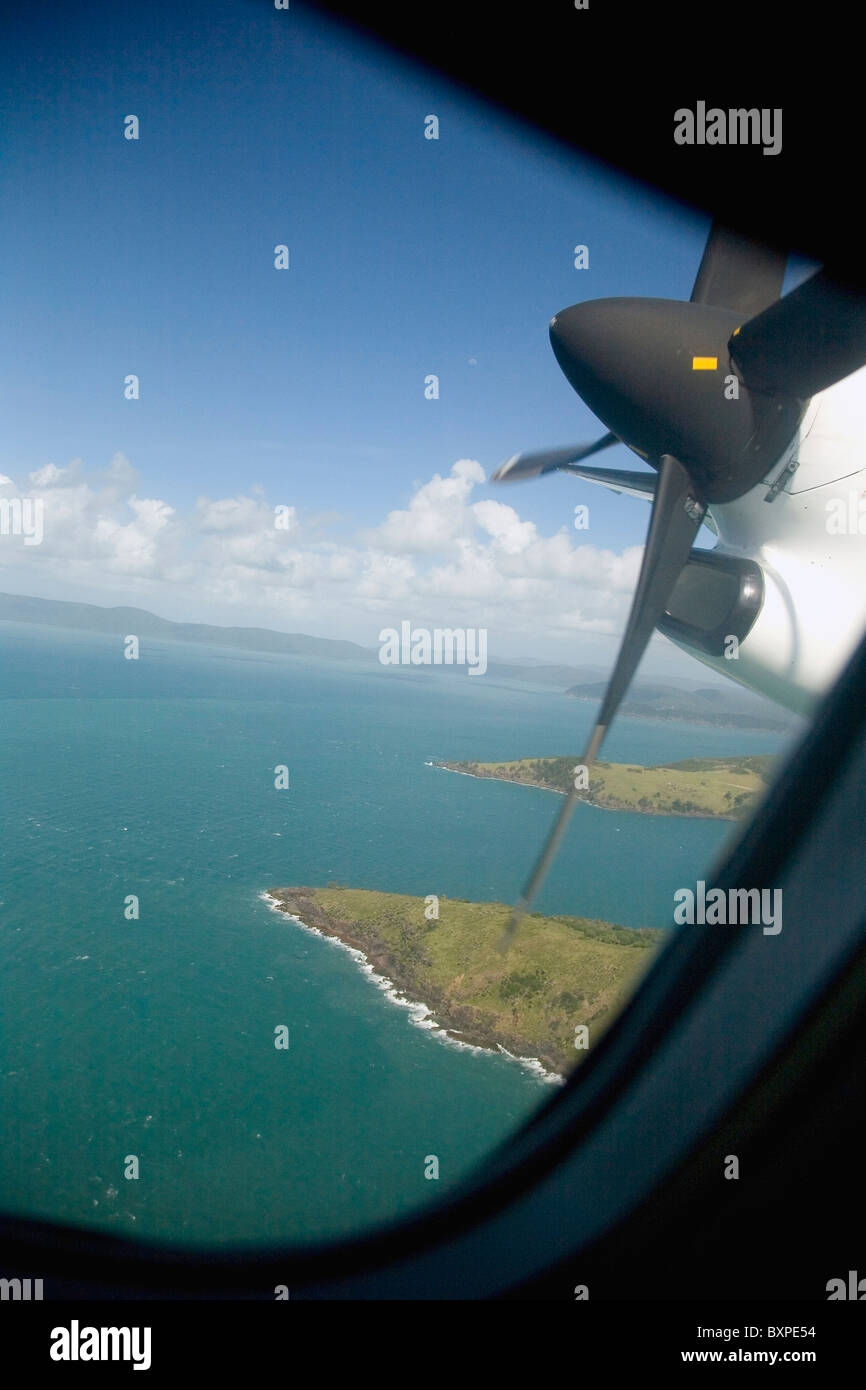 View Through Airplane Window Of Tropical Islands Stock Photo - Alamy