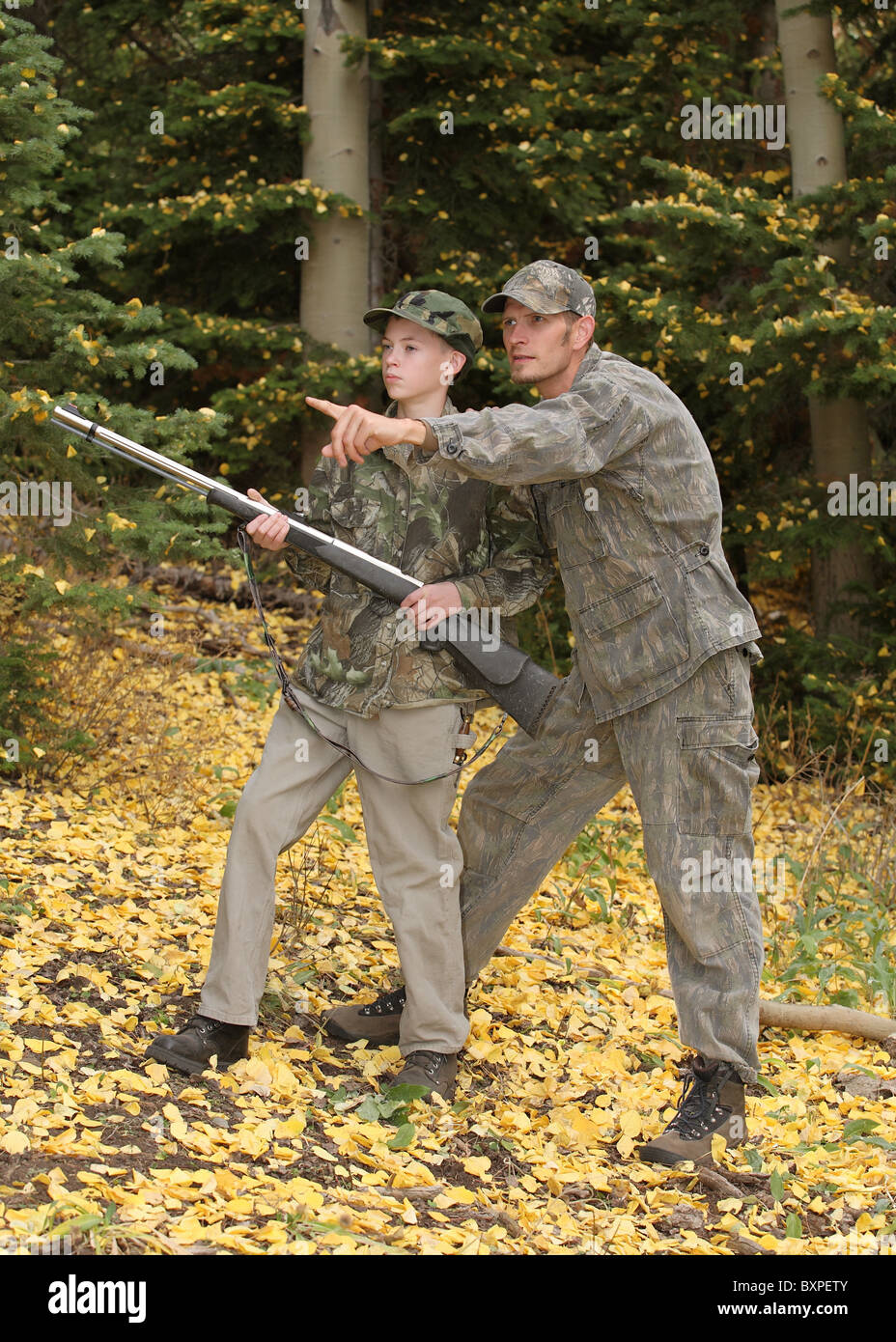 father pointing and guiding son on first deer hunt Stock Photo - Alamy
