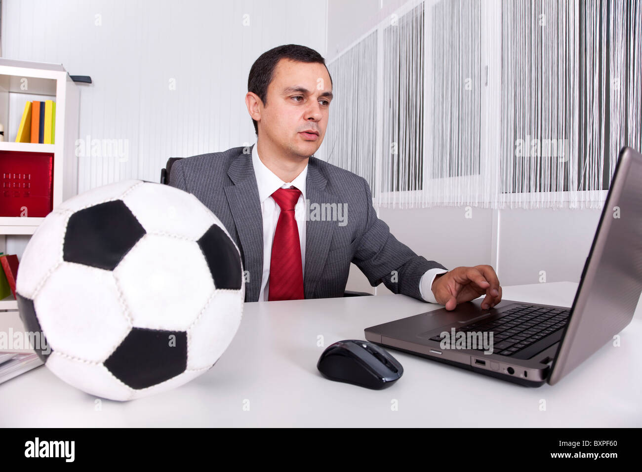 Mature football businessman manager working at the office Stock Photo ...