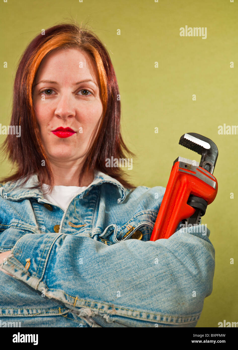 Self-sufficient, confident woman with hand tool Stock Photo - Alamy