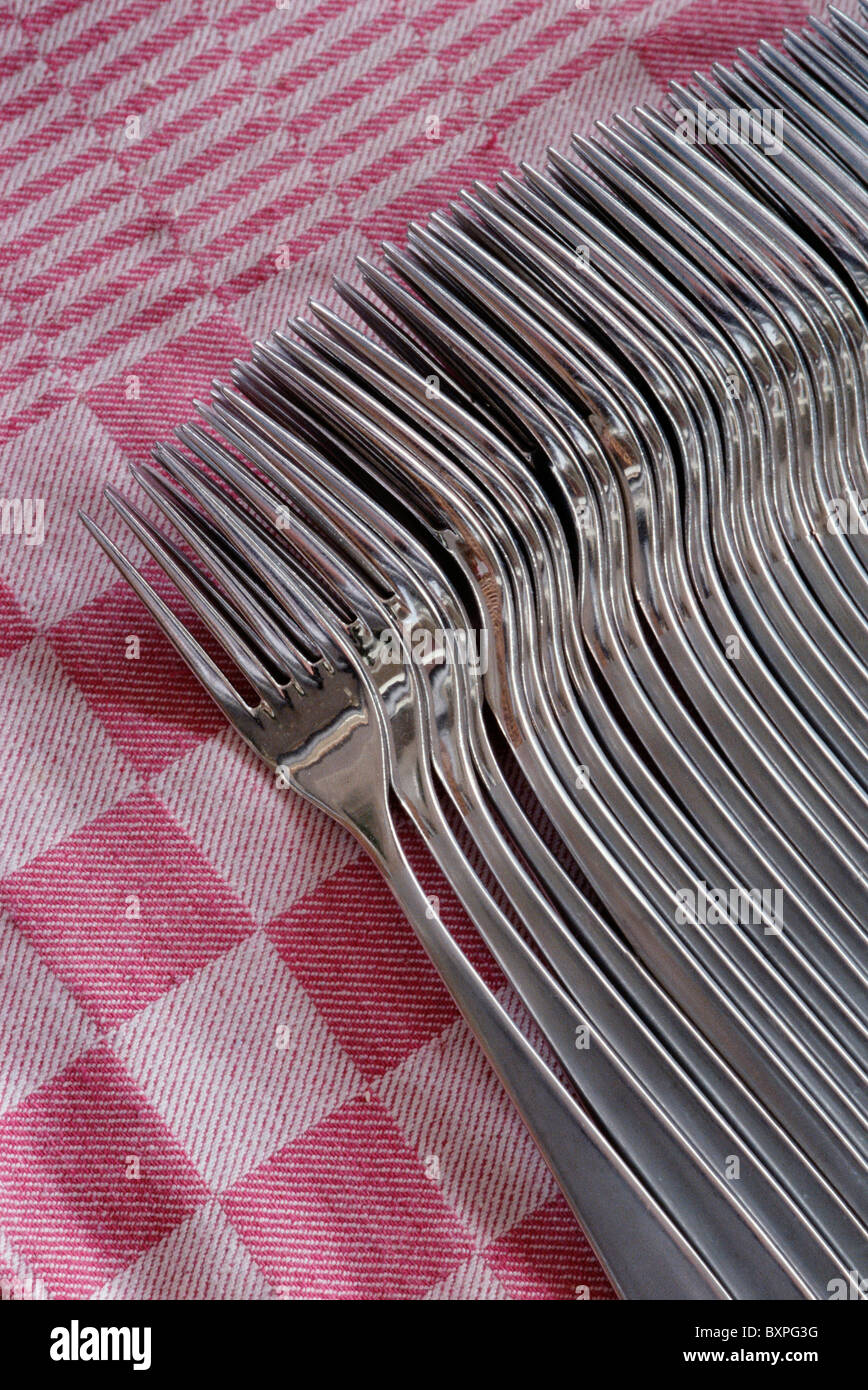 Stack Of Forks On A Table Stock Photo - Alamy