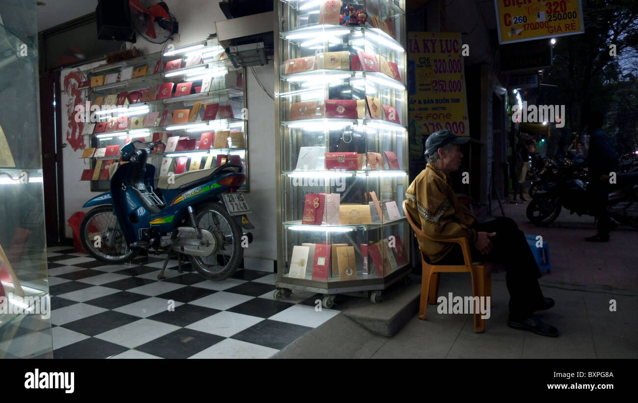Man looking after his stall Stock Photo - Alamy