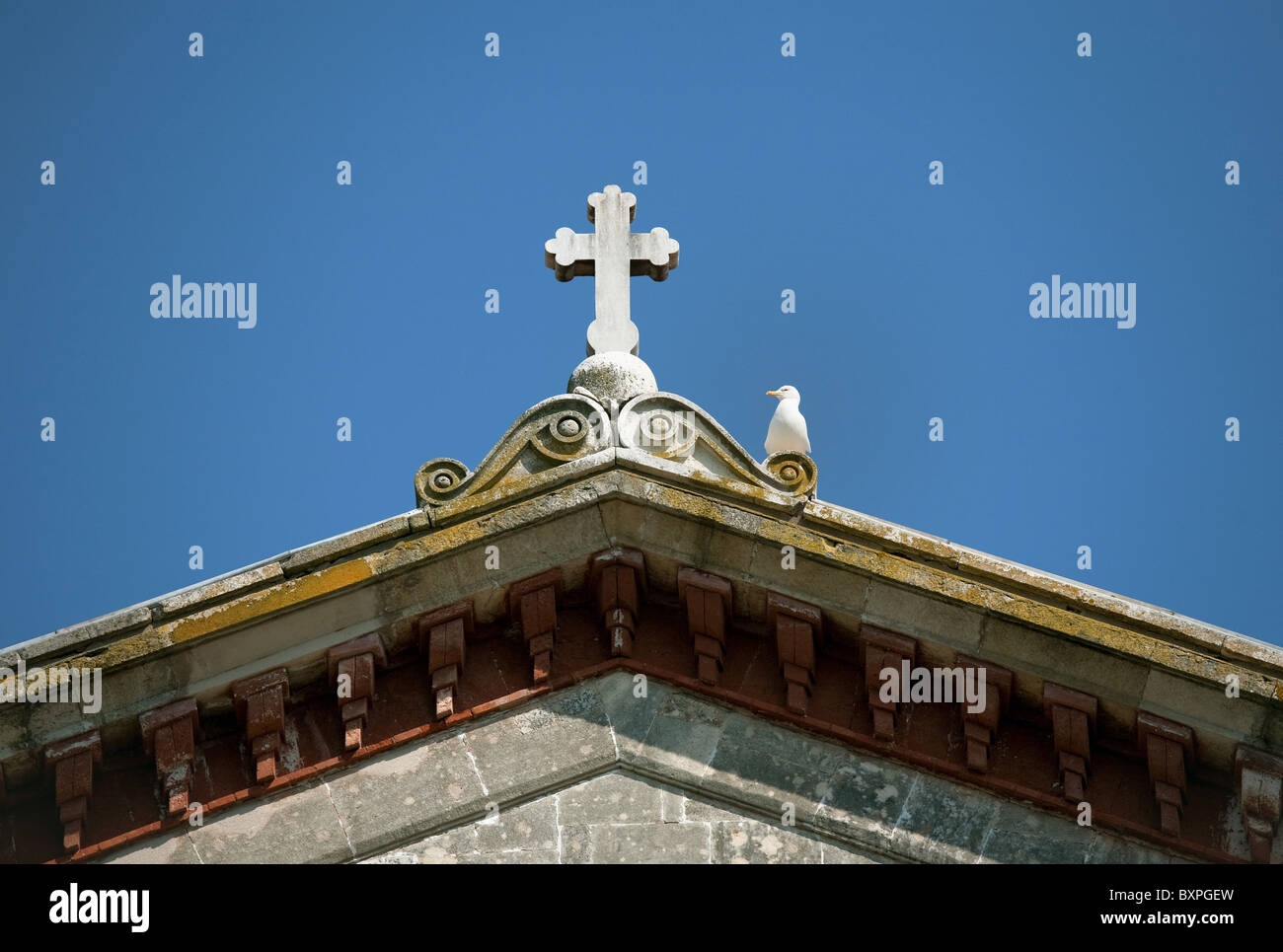 Cross and a seagull on the main building of the Halki Seminary ...